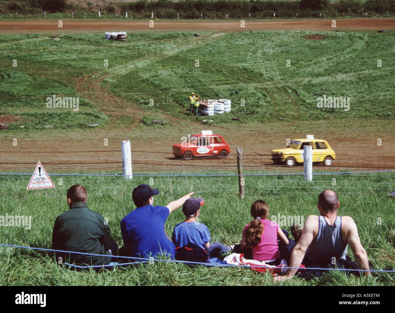 Father and children sat watching dirt track races, Forest of Dean ...