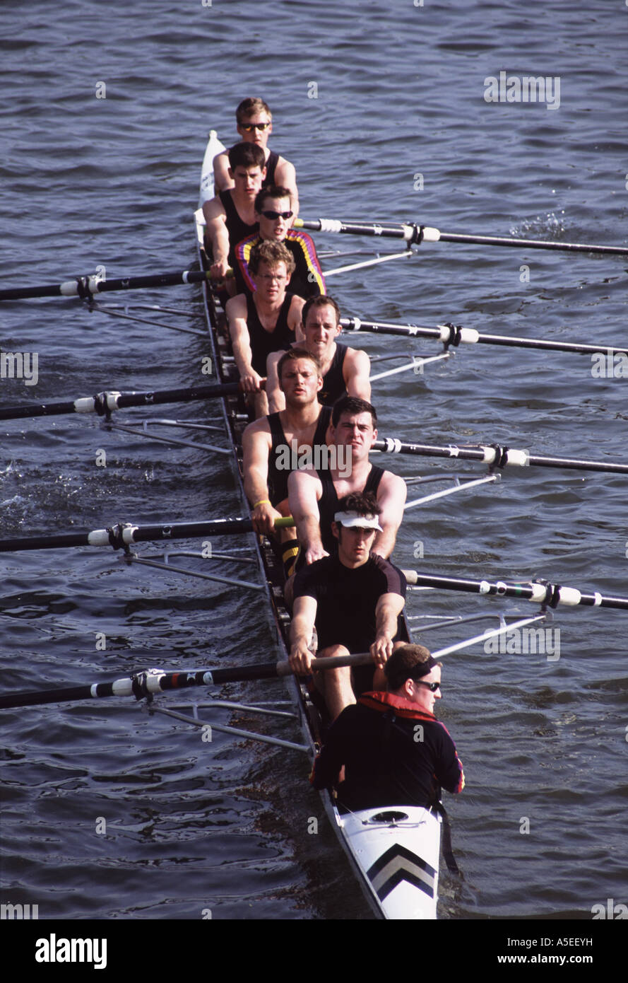 8 young men with straining faces rowing hard competing in the Oxford ...