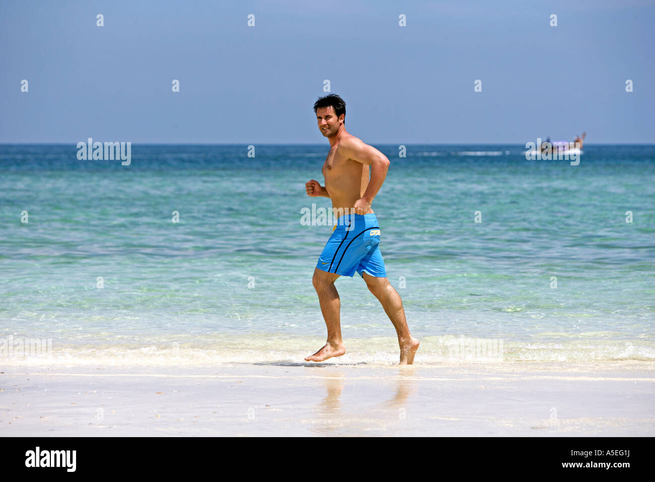 man jogging on tropical beach in Thailand Krabi Stock Photo - Alamy