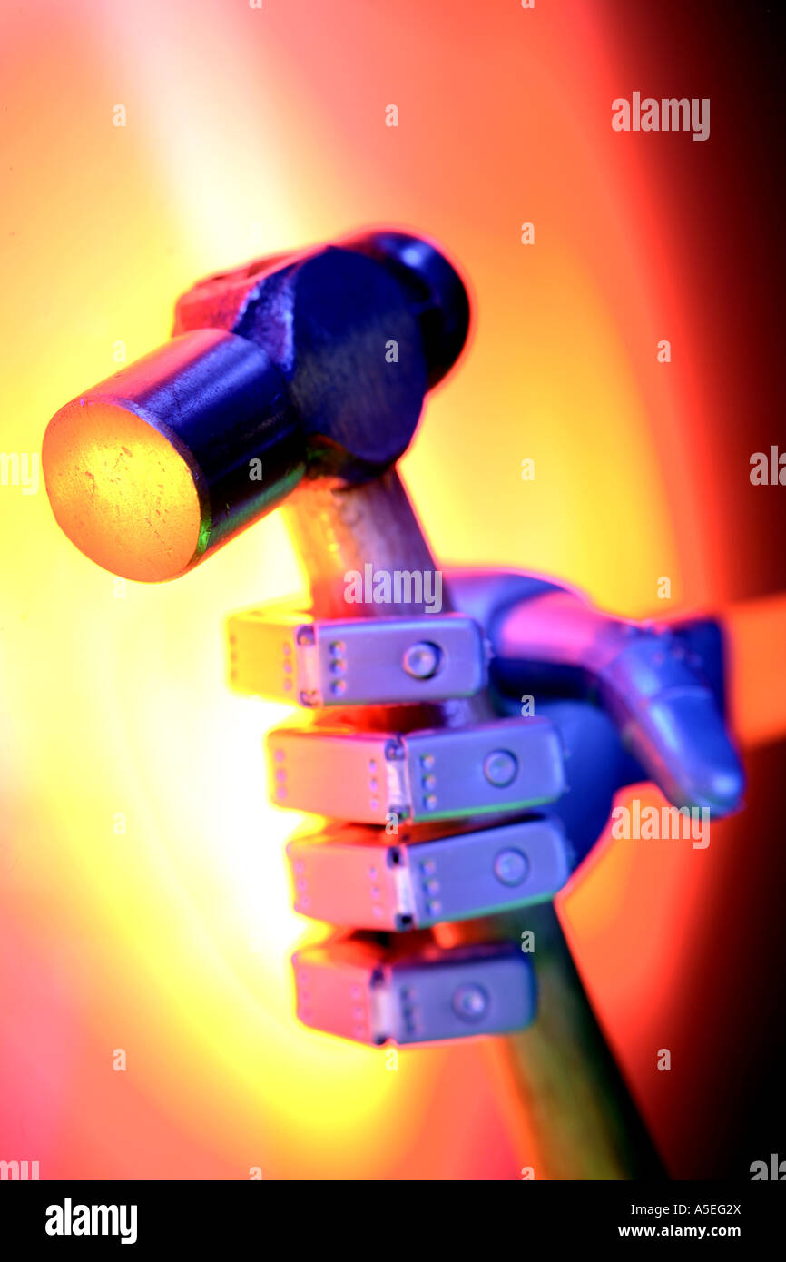 Robot hand holding hammer Stock Photo - Alamy