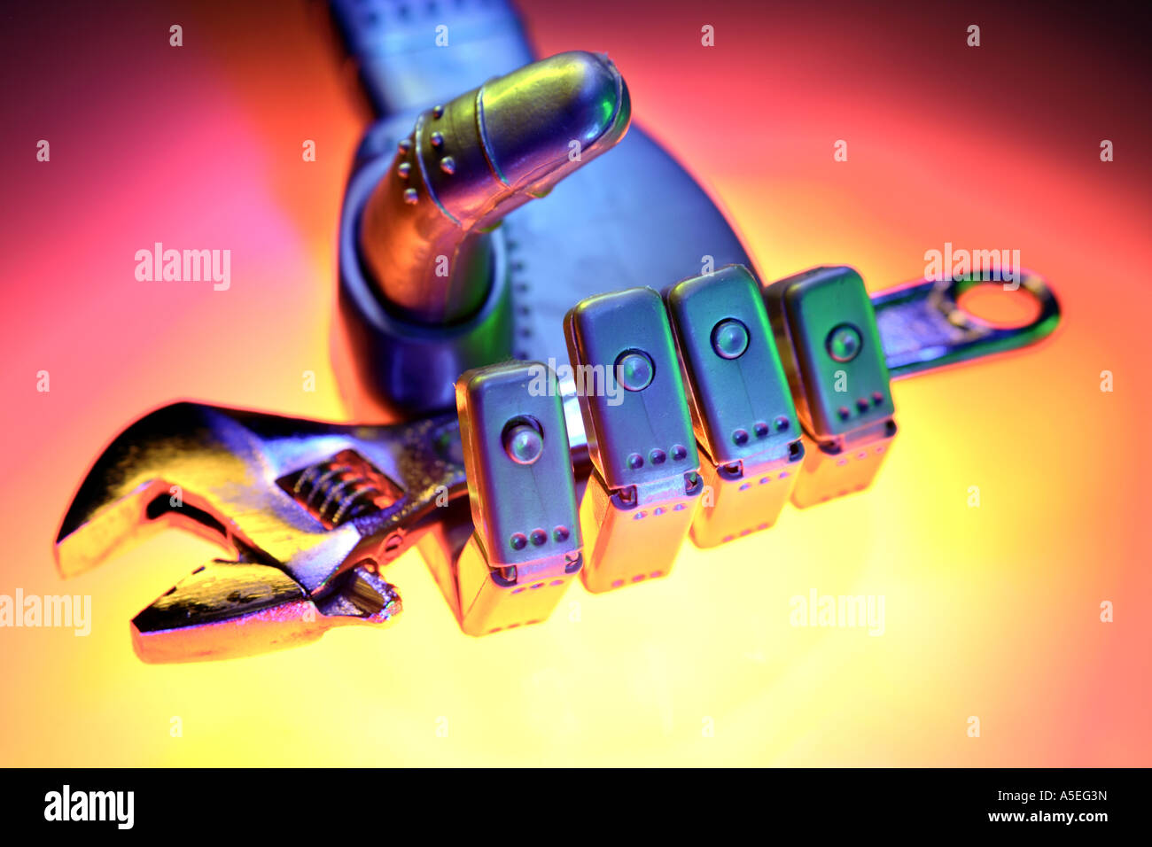 Robot hand holding wrench Stock Photo - Alamy