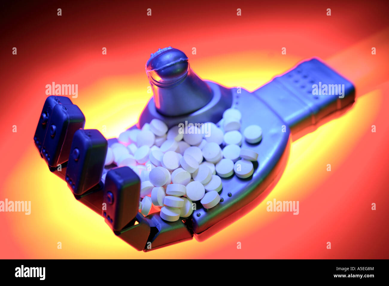 Pills in robot hand Stock Photo - Alamy