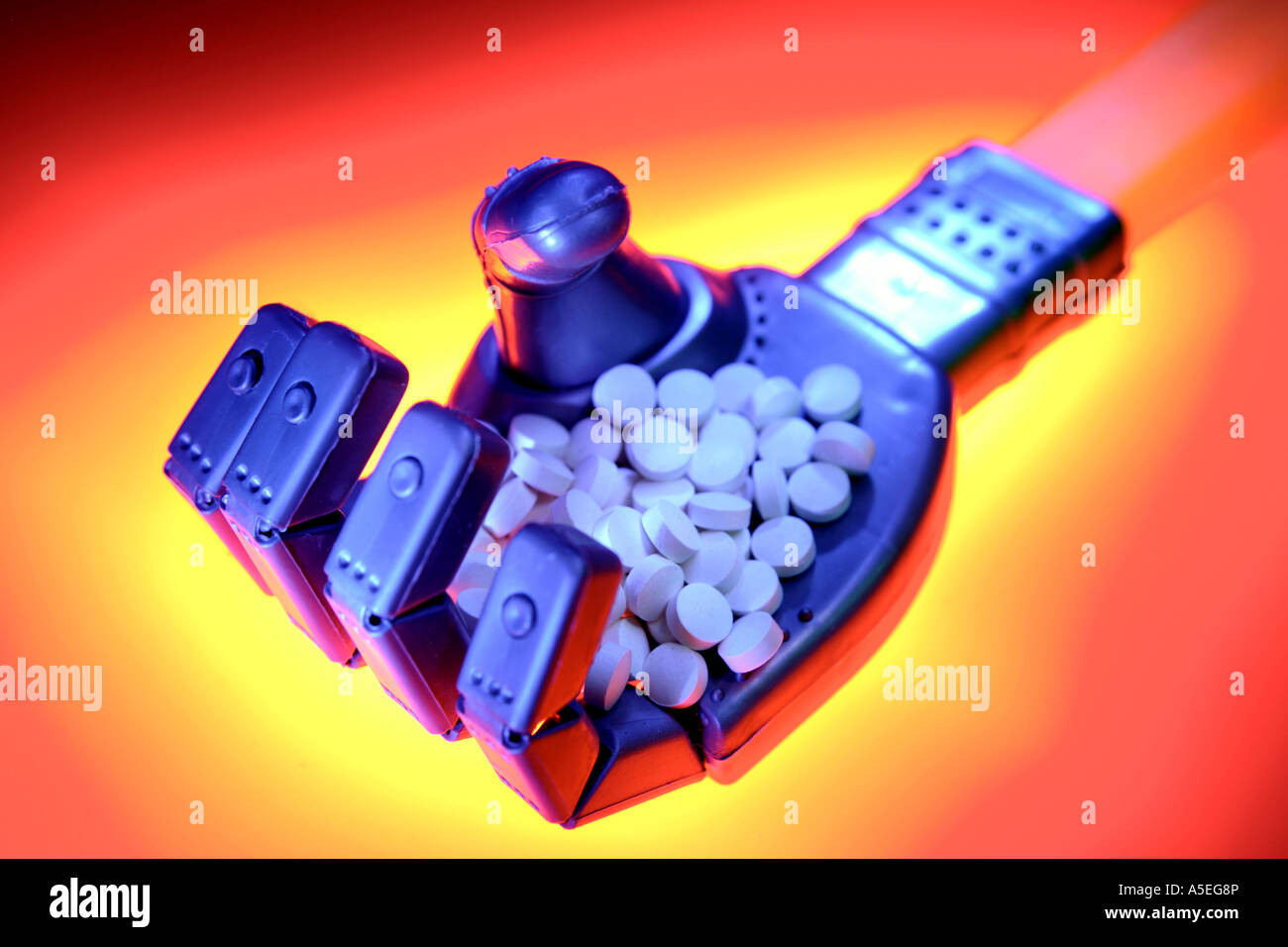 Pills in robot hand Stock Photo - Alamy