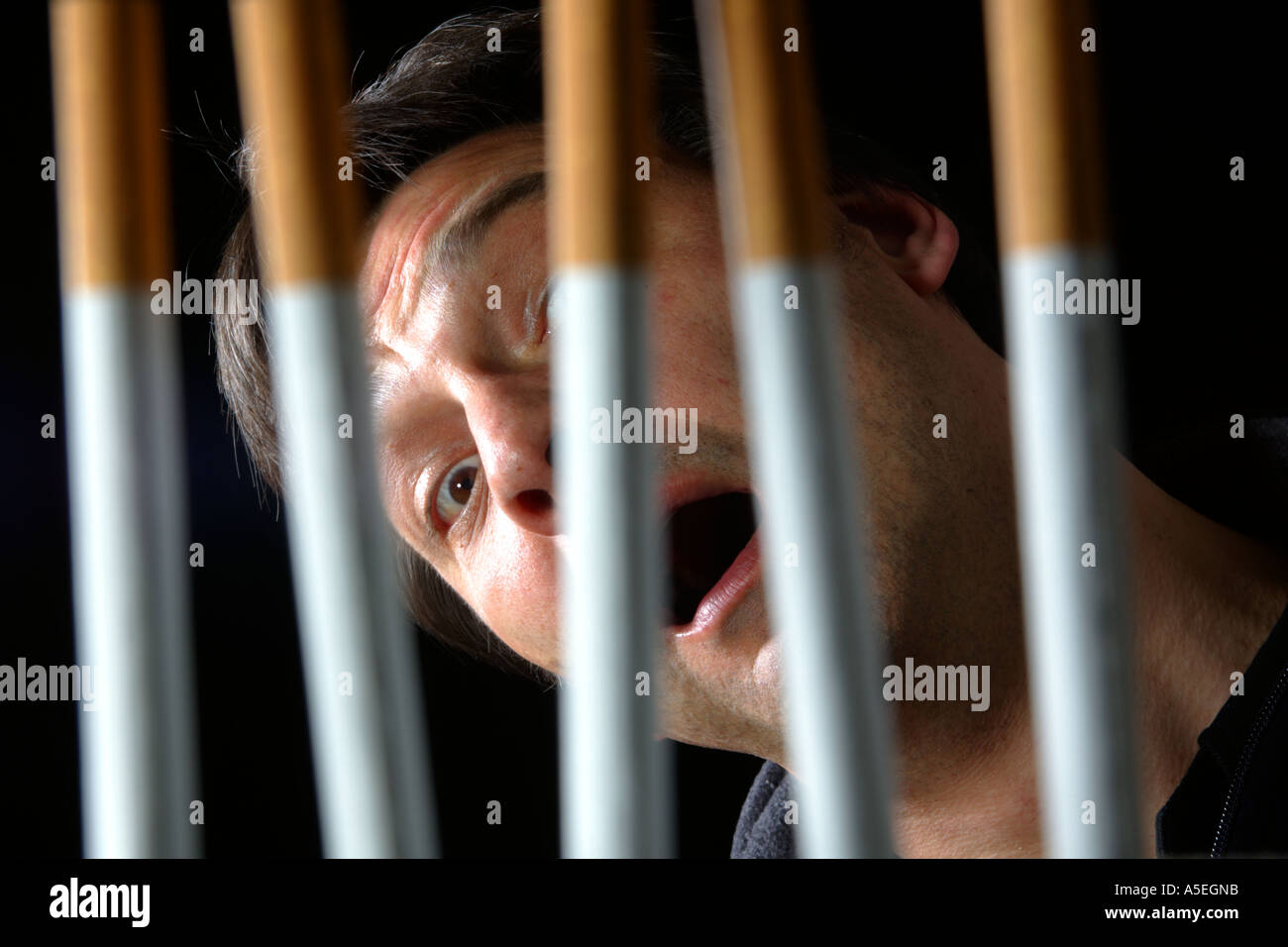 Smoker trapped behind the prison bars of addiction to nicotine Stock ...