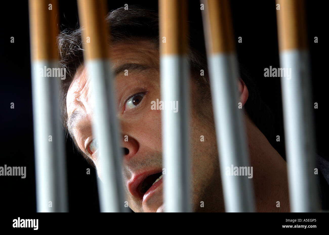 Smoker trapped behind the prison bars of addiction to nicotine Stock ...