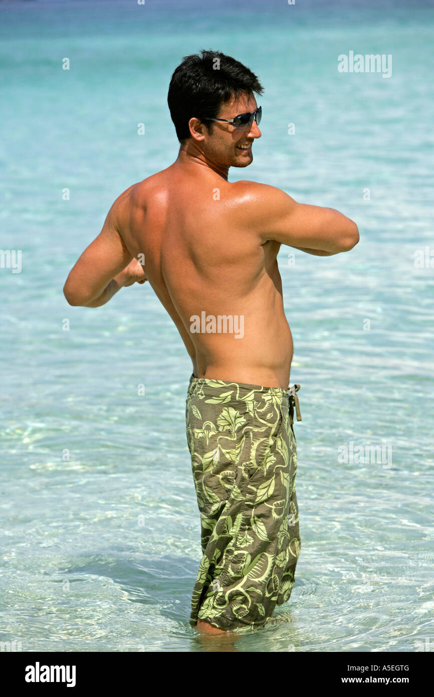 Man enjoying holidays at tropical beach in Thailand Stock Photo - Alamy
