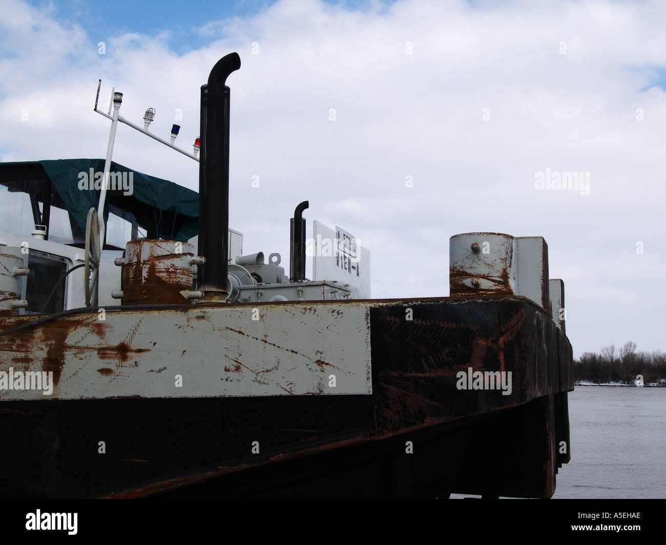 rusty cargo ship at the river bank Stock Photo - Alamy