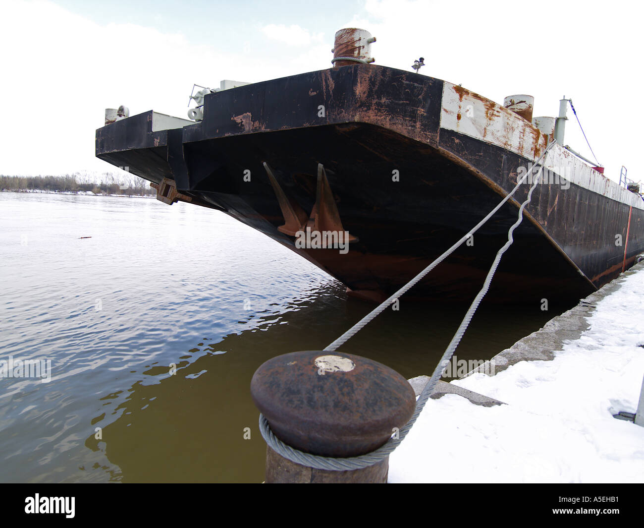 rusty cargo ship at the river bank Stock Photo - Alamy
