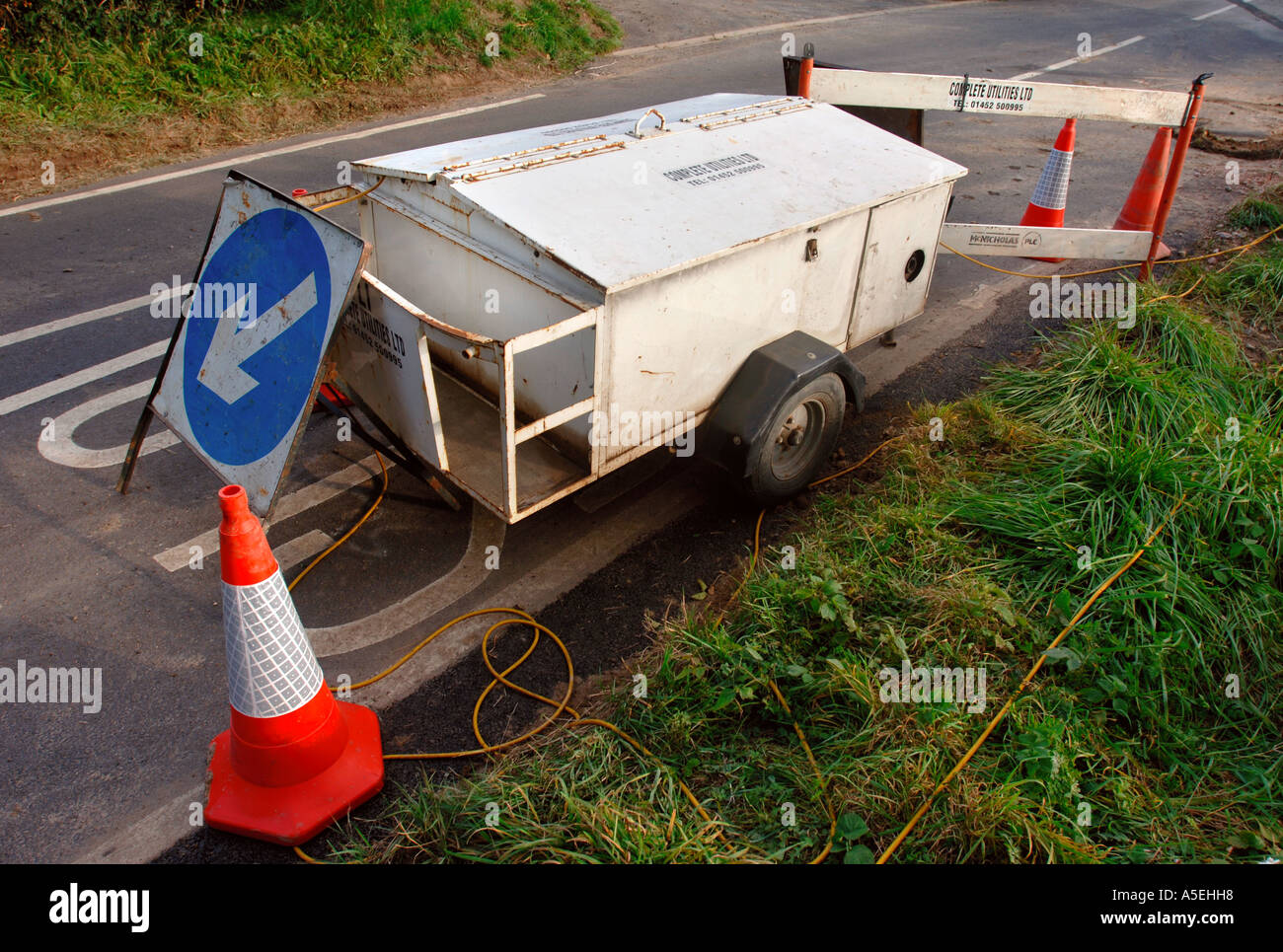 A MOBILE GENERATOR BEING USED TO POWER TEMPORARY TRAFFIC LIGHTS AT A ...
