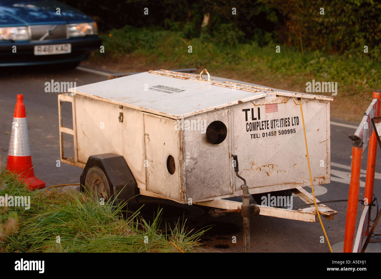 A MOBILE GENERATOR BEING USED TO POWER TEMPORARY TRAFFIC LIGHTS AT A ...