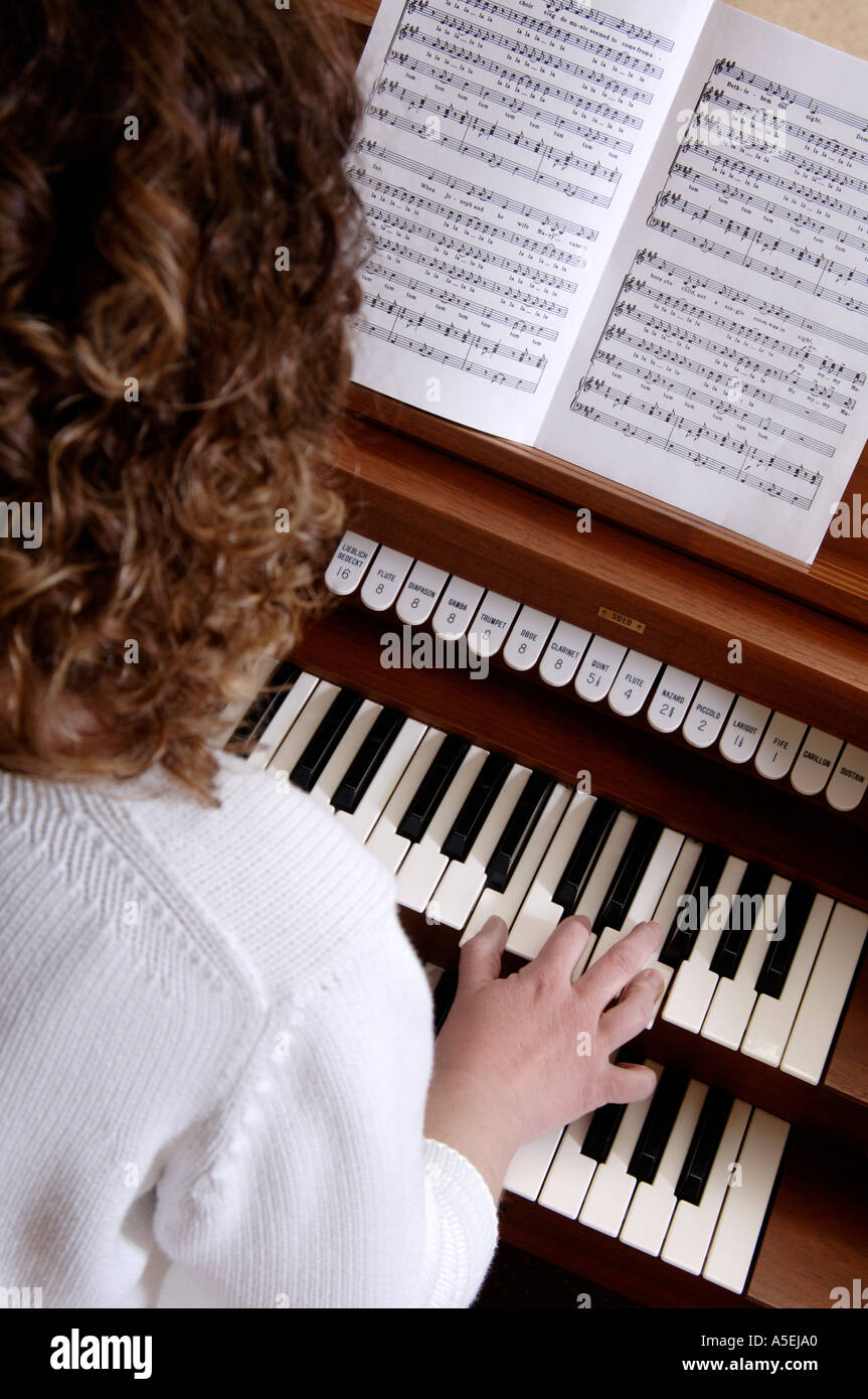 Woman playing organ hi-res stock photography and images - Alamy