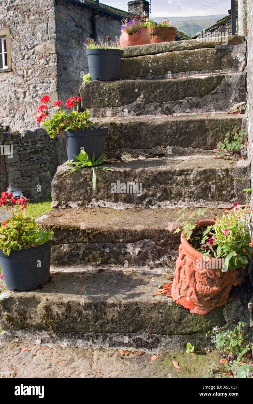 A set of granite stone steps leading up to a loft barn Stock Photo - Alamy