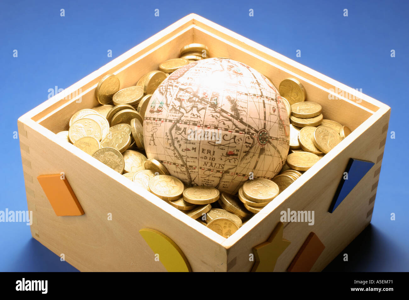 Globe and Coins in Box Stock Photo - Alamy