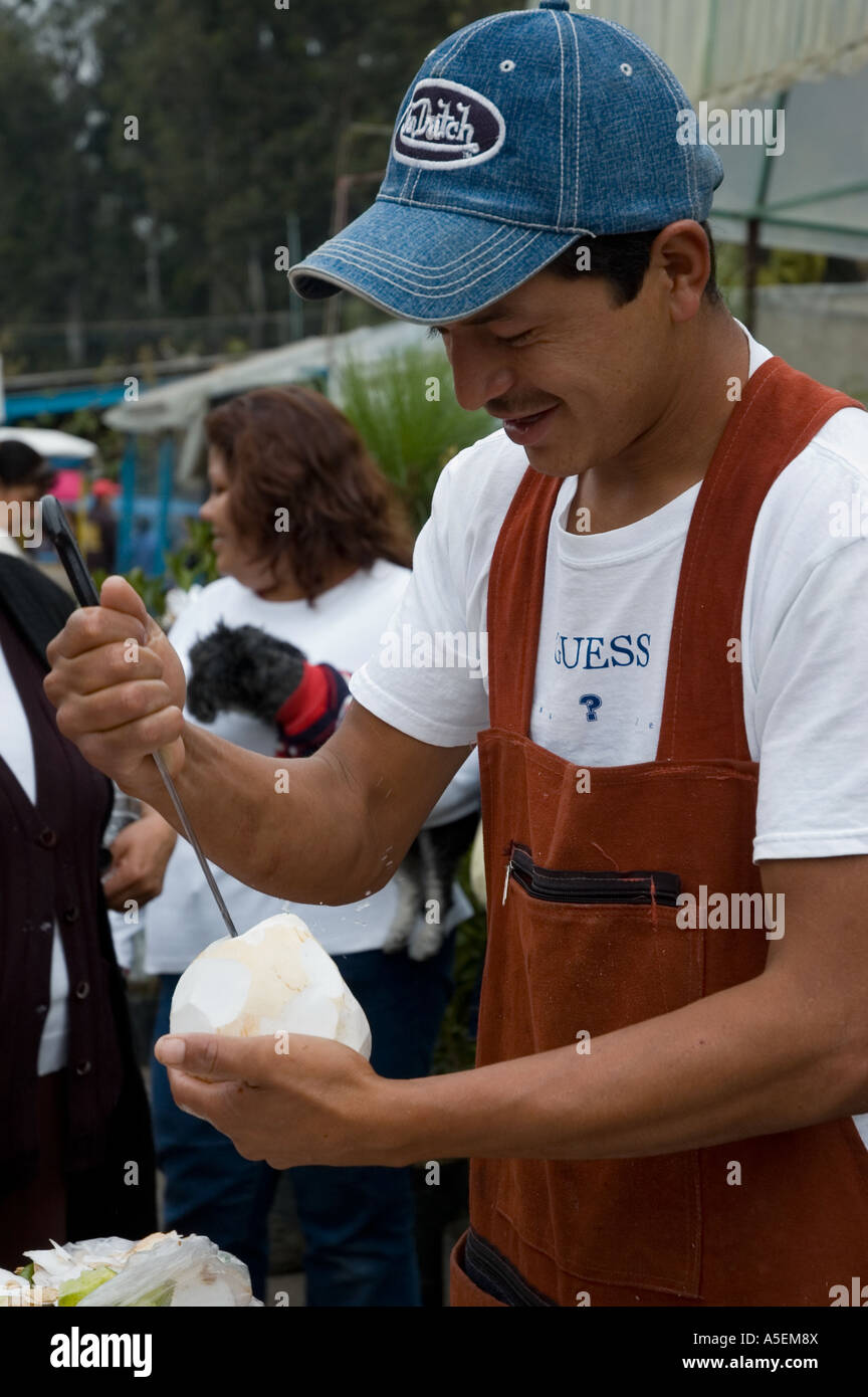a boy peeling cocos - mexico Stock Photo - Alamy