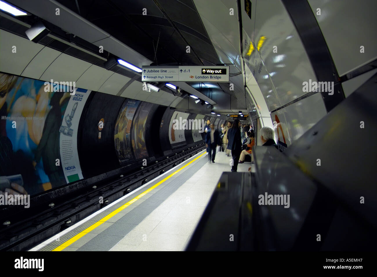 London Bridge tube station the underground Train departing with people ...