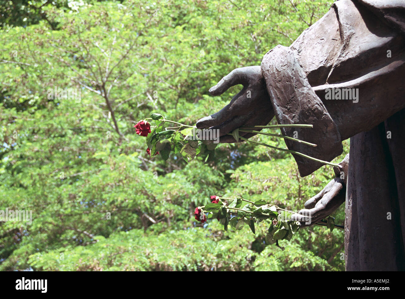 statue holding roses in rome Stock Photo - Alamy