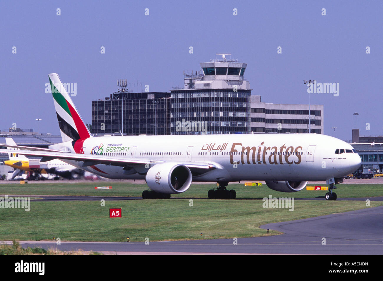 Boeing 777 operated by Emirates taxiing out at Manchester Airport Stock ...