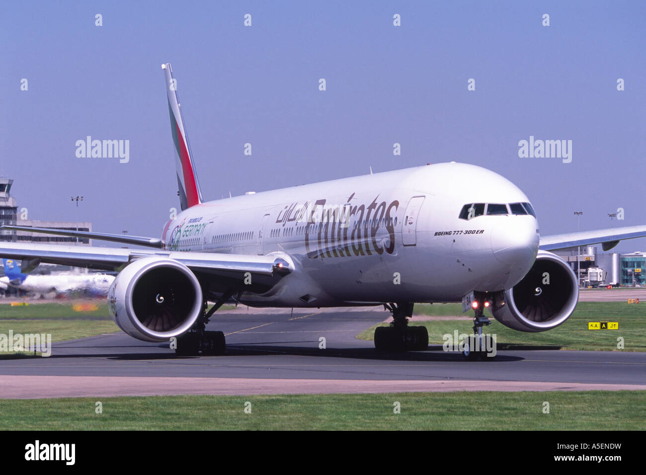 Boeing 777 operated by Emirates taxiing out at Manchester Airport Stock ...