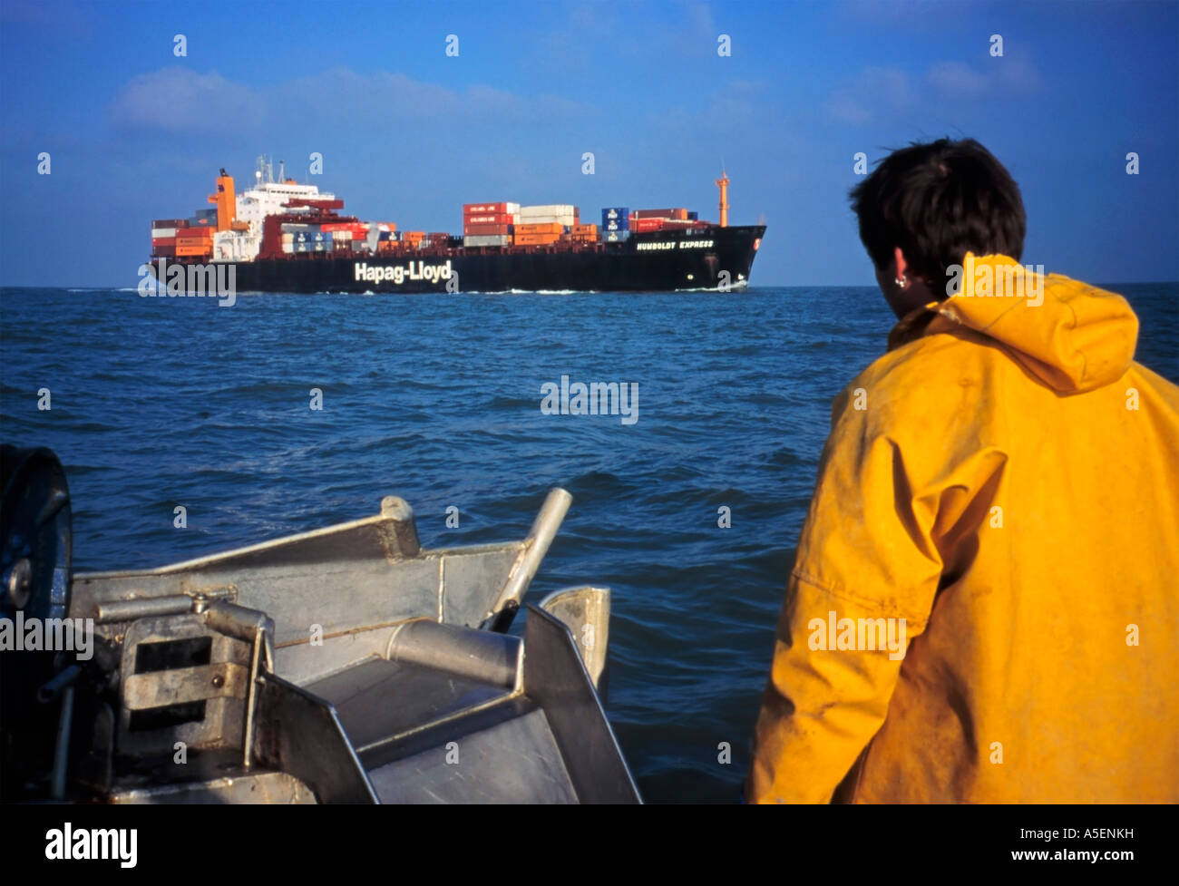 Hauling in onboard a Long line fishing Boat with Containership Passing ...