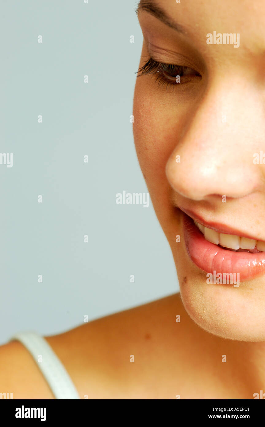 beauty shot half front view of woman s smiling face Stock Photo - Alamy