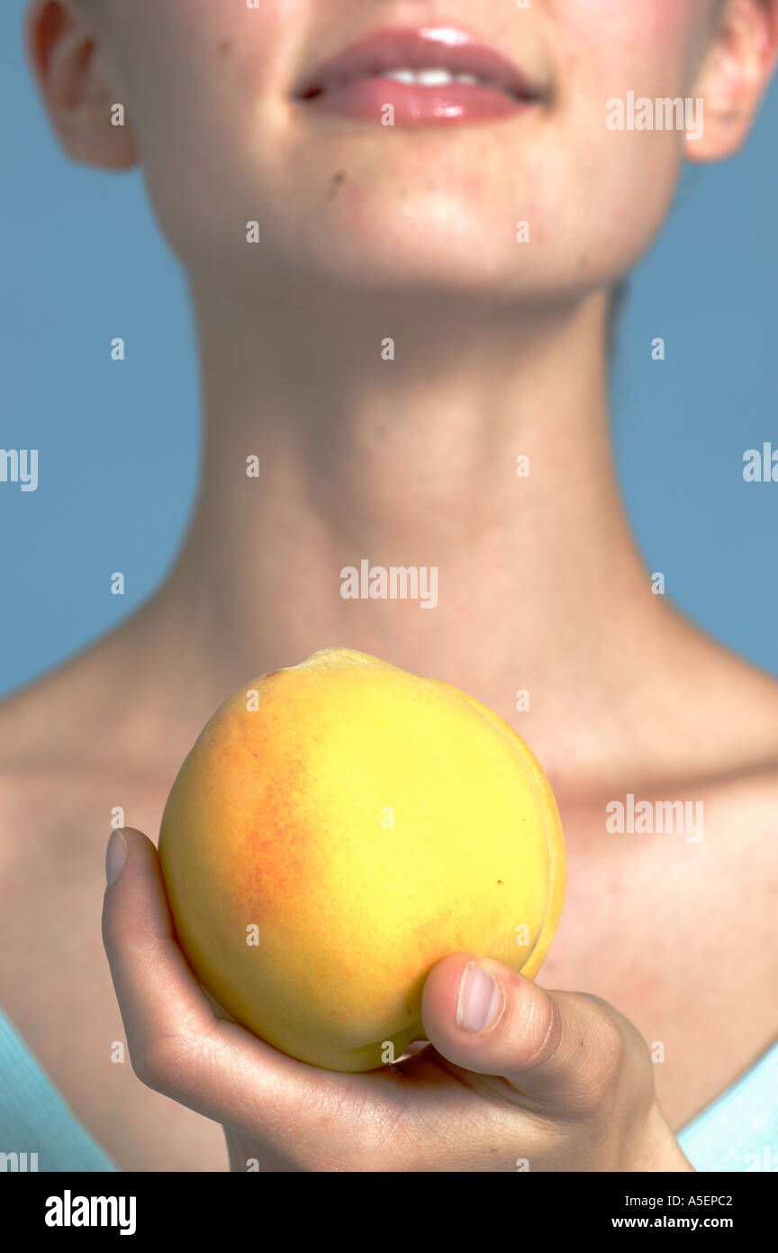 fruit presentation woman holding a piece of fruit Stock Photo - Alamy