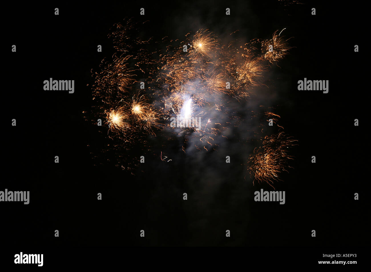 "Bright fireworks exploding against a dark night sky Stock Photo - Alamy