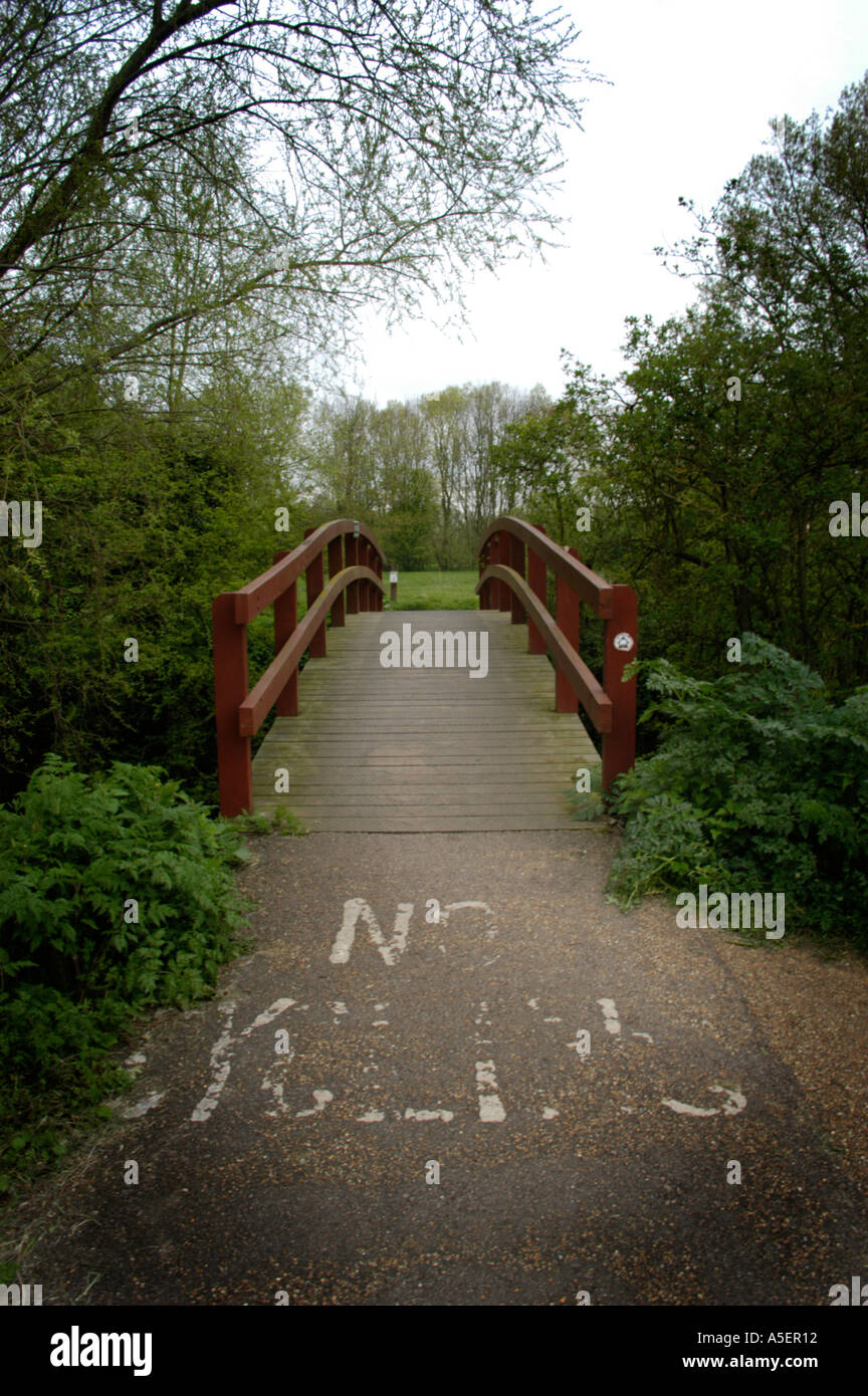 wooden bridge cycle track and walkway over river in country park Stock ...