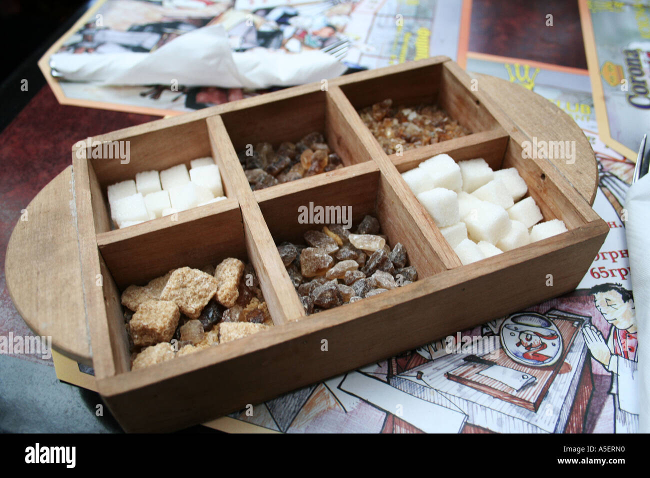 Assorted sugar cubes in a wooden box, sweetening options for tea or ...