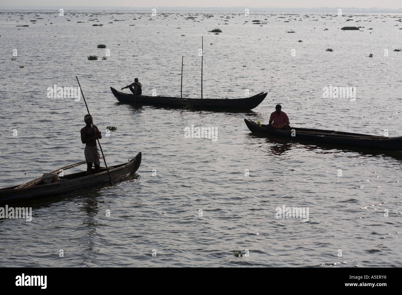 Men fishing in their boats Stock Photo - Alamy