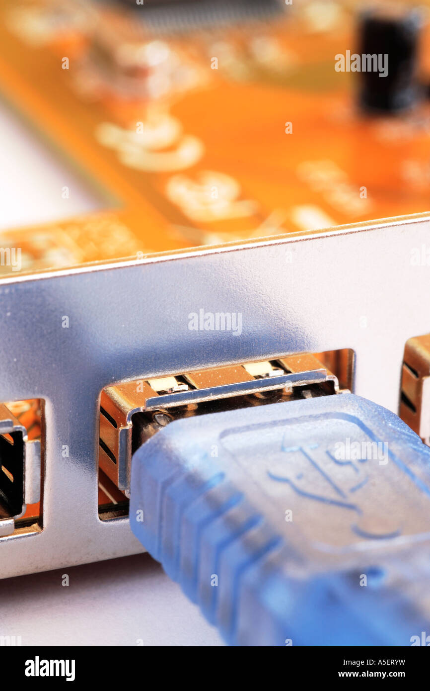 Computer USB cable connecting to port Stock Photo - Alamy