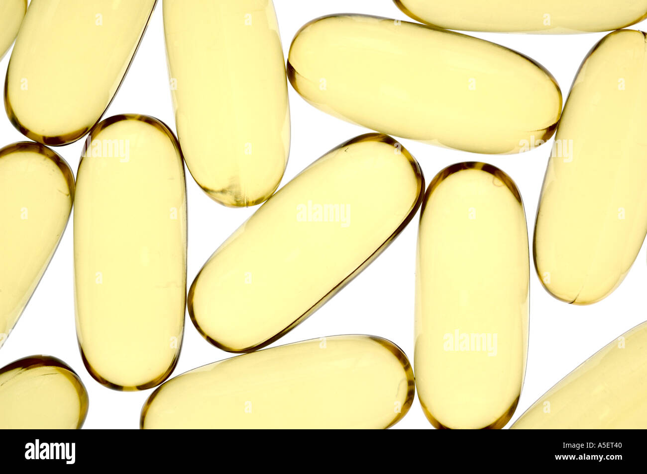 Cod liver or evening primrose oil tablets on white background Stock ...
