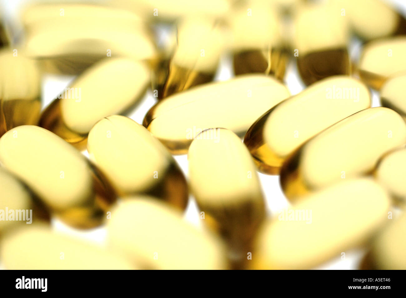 Cod liver or evening primrose oil tablets on white background Stock ...