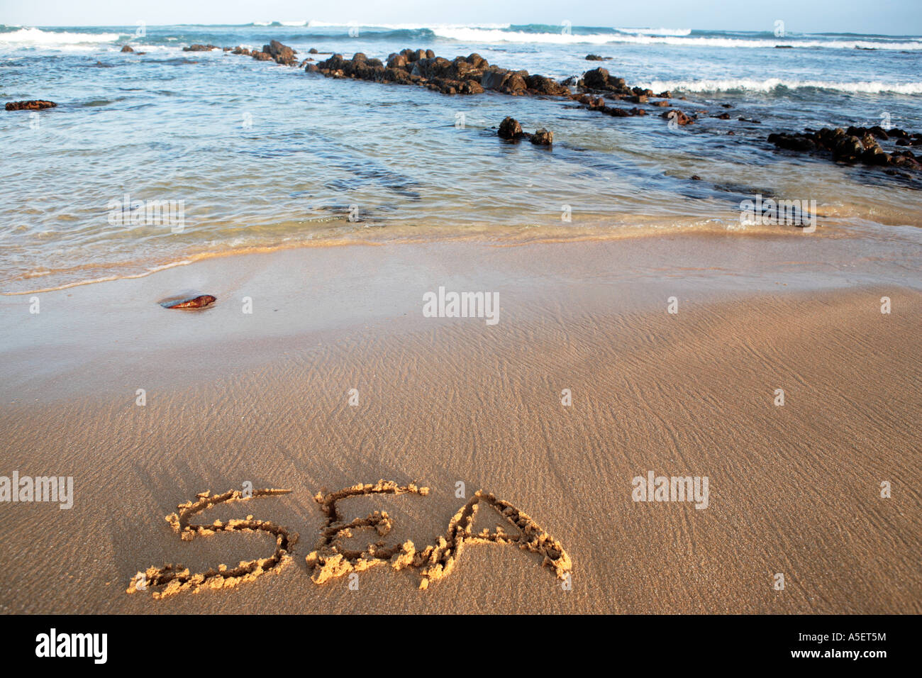 The word ‘Sea’ written in sand on beach South Africa Stock Photo - Alamy
