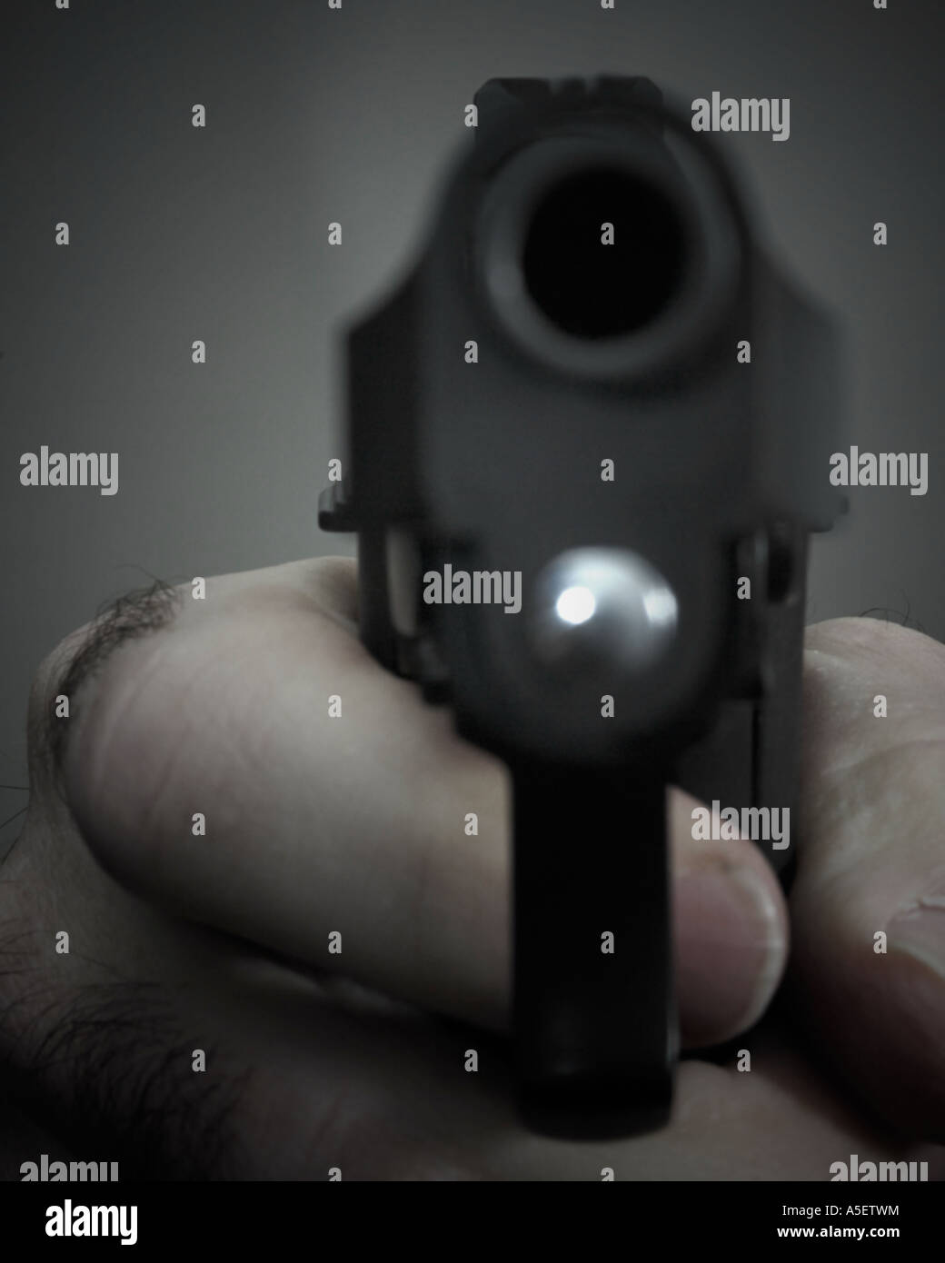 muzzle of a pointed pistol Stock Photo - Alamy