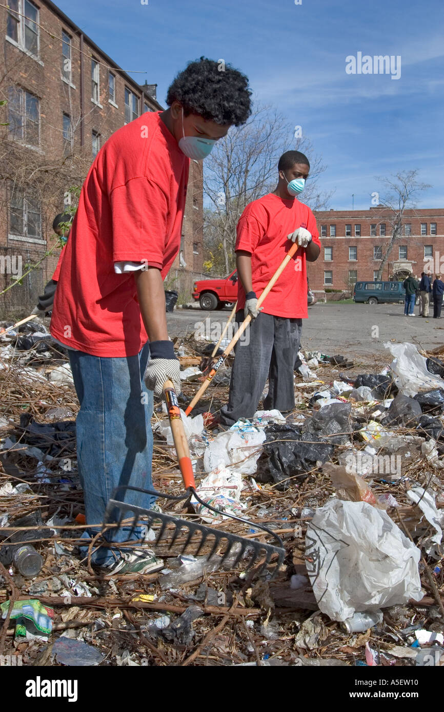 High School Volunteers Clean Grounds of Homeless Shelter Stock Photo ...