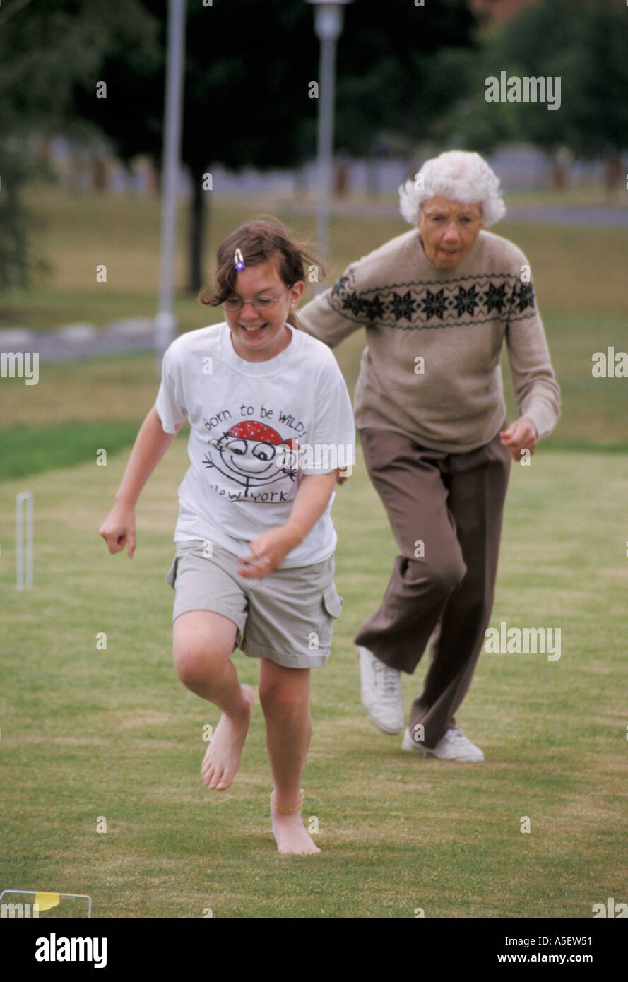 Granddaughter and grandmother running hi-res stock photography and ...