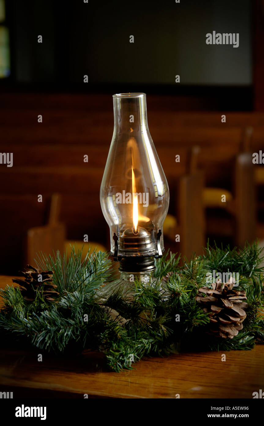 Oil lamp and Bible in church setting Stock Photo - Alamy