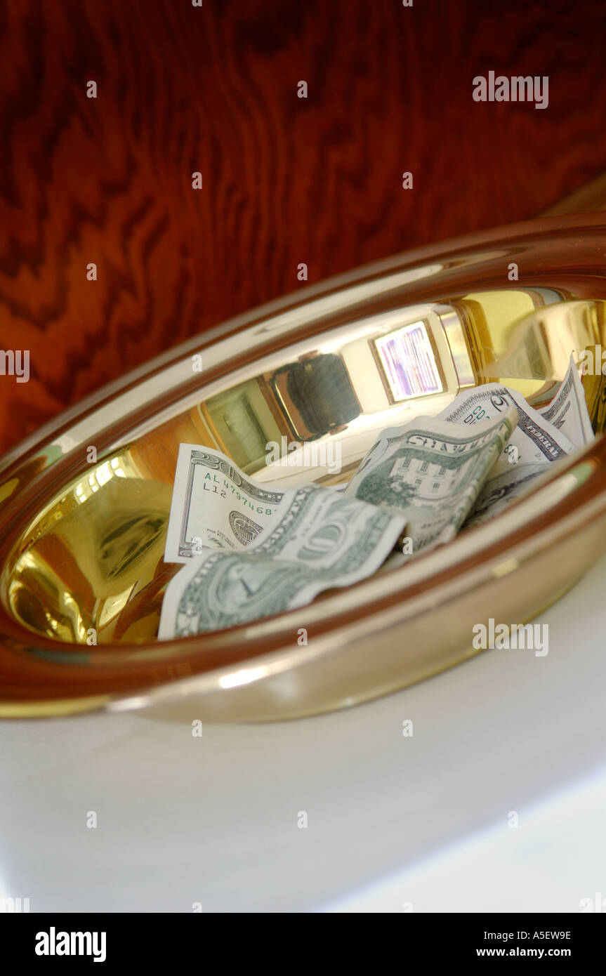 Church offering plate Stock Photo - Alamy