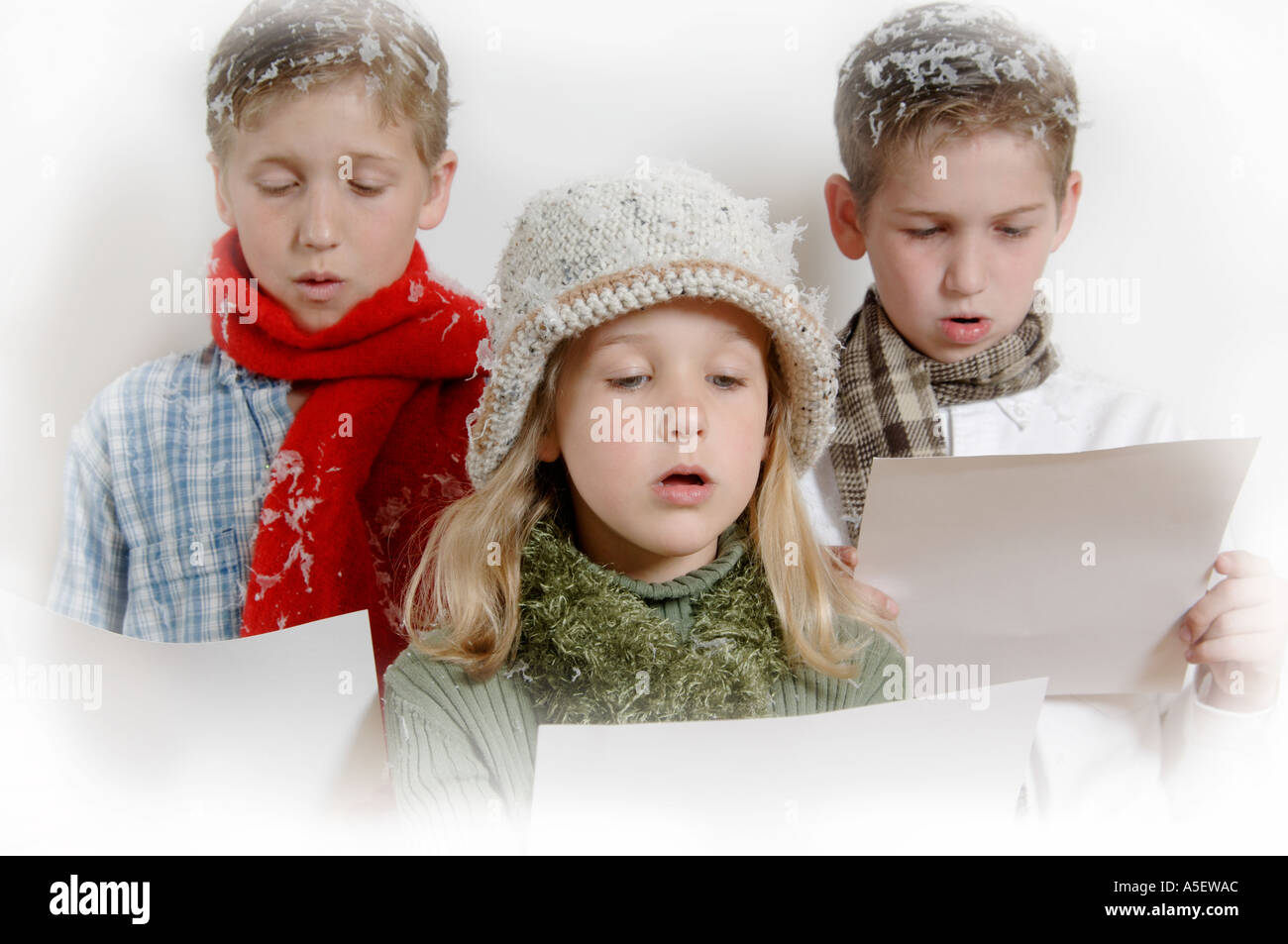 Christmas caroling snow hi-res stock photography and images - Alamy