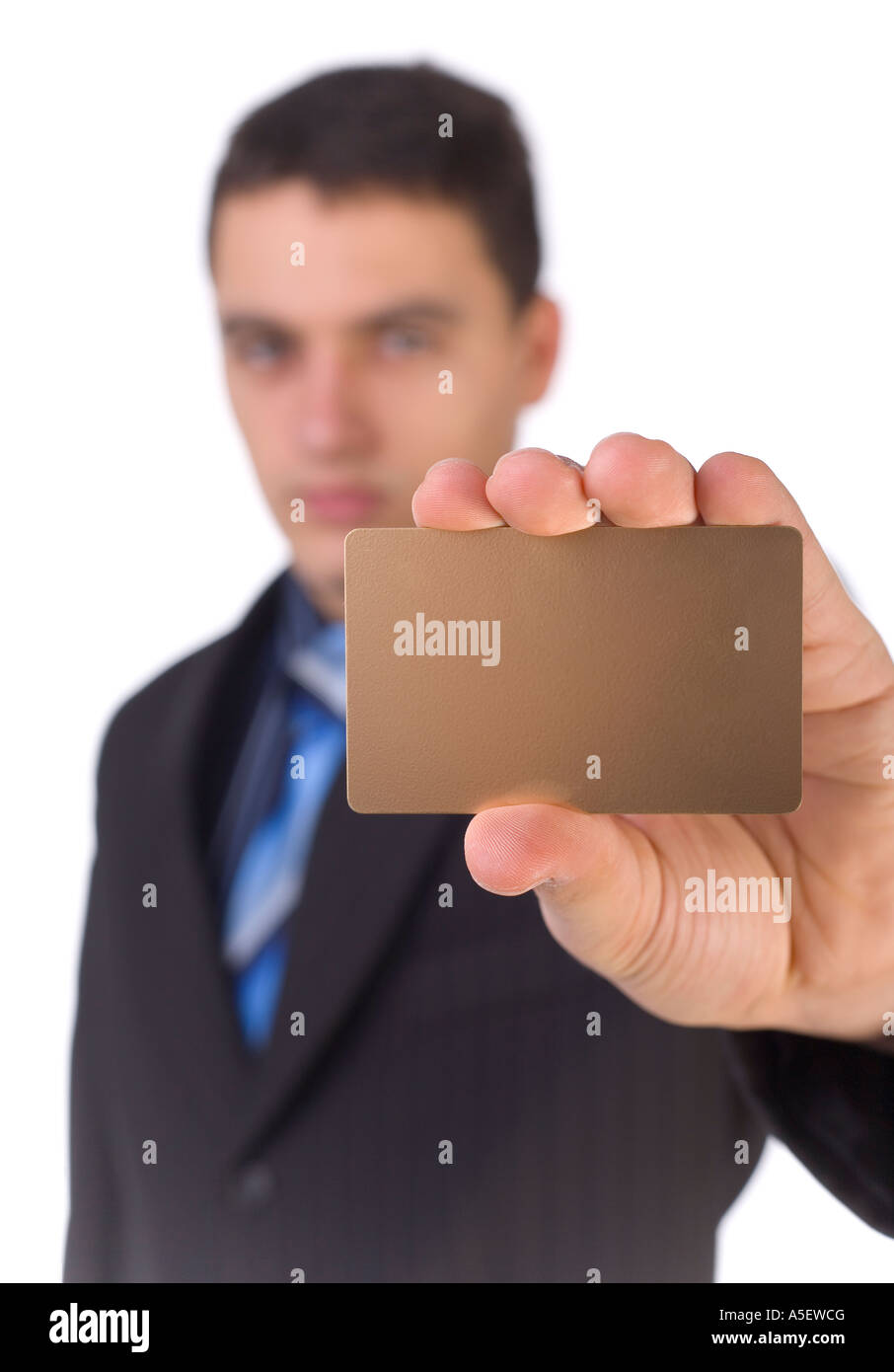 Young man showing gold card White background in studio Focus on the ...