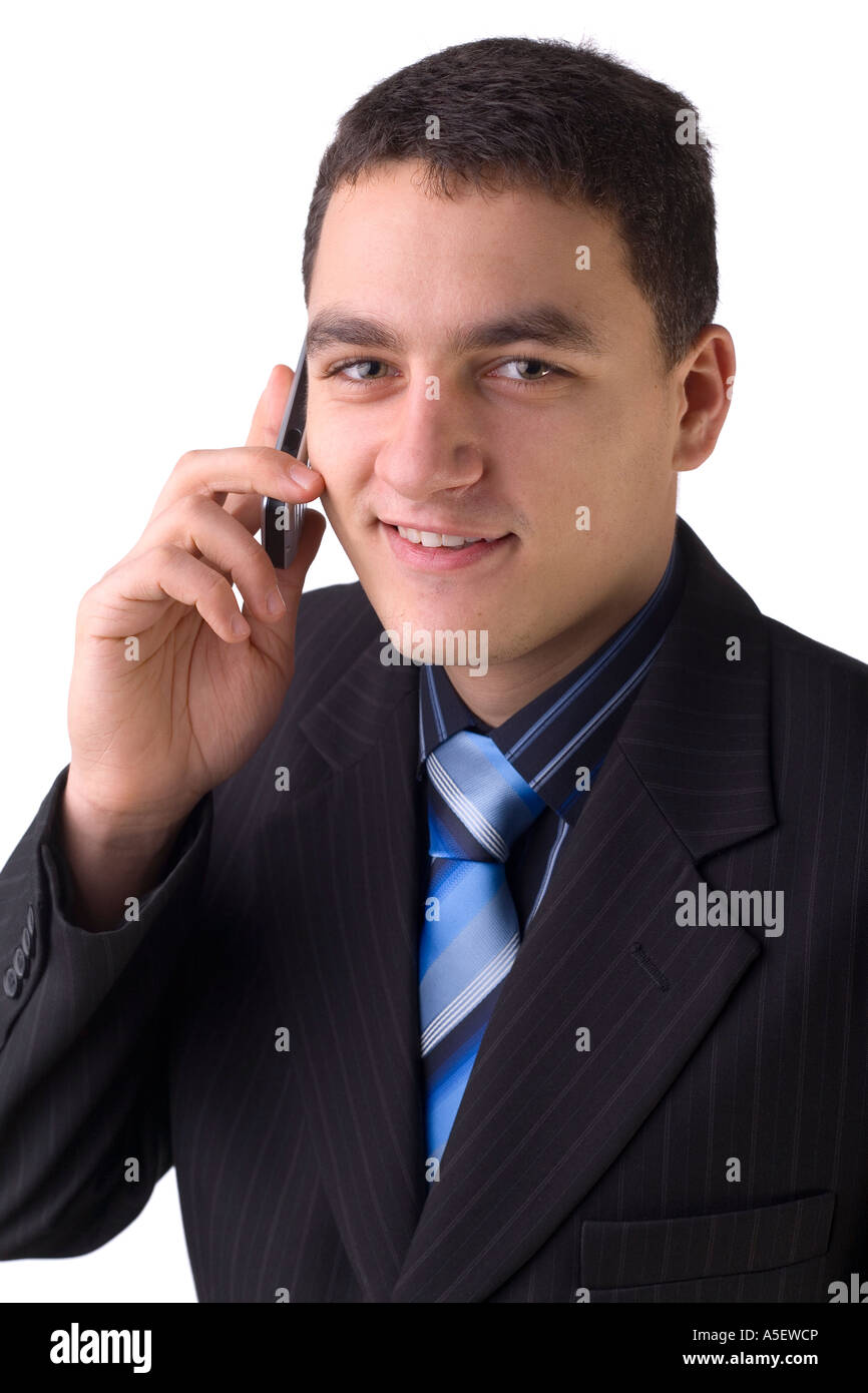 Young man with mobile phone isolated on white background in studio ...
