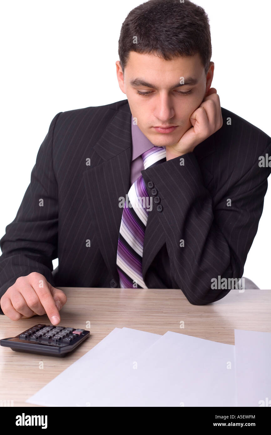 Businessman at the office desk counting There are papers and a ...