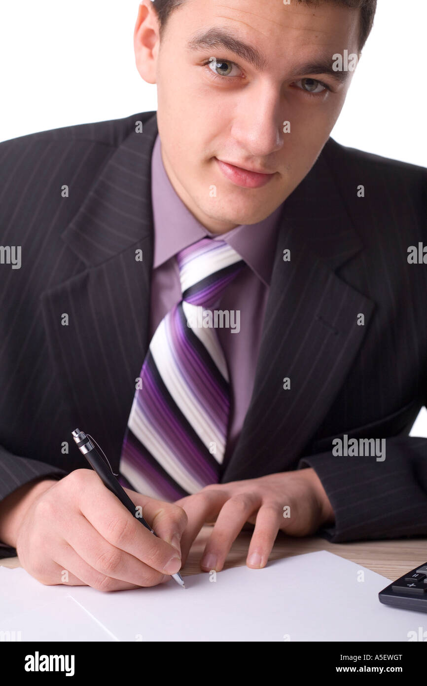 Businessman at the desk with signing agreement Focus on the eyes ...