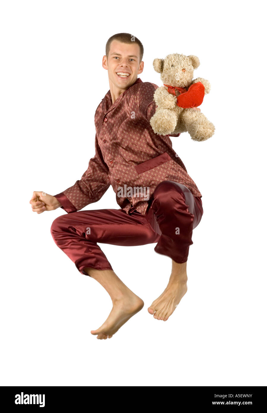 isolated flying pyjamas man with teddy bear Stock Photo - Alamy