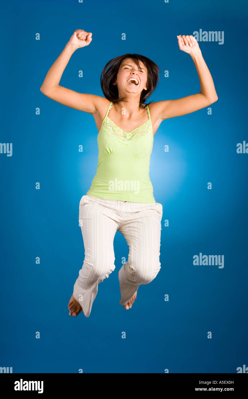 jumping happy woman shows win Stock Photo - Alamy