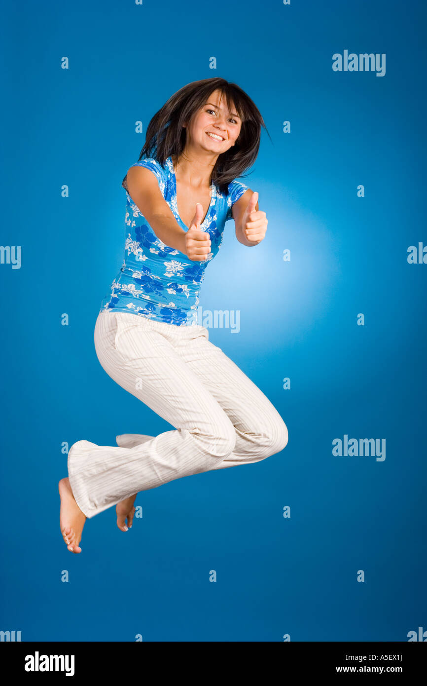 jumping happy woman shows OK Stock Photo - Alamy