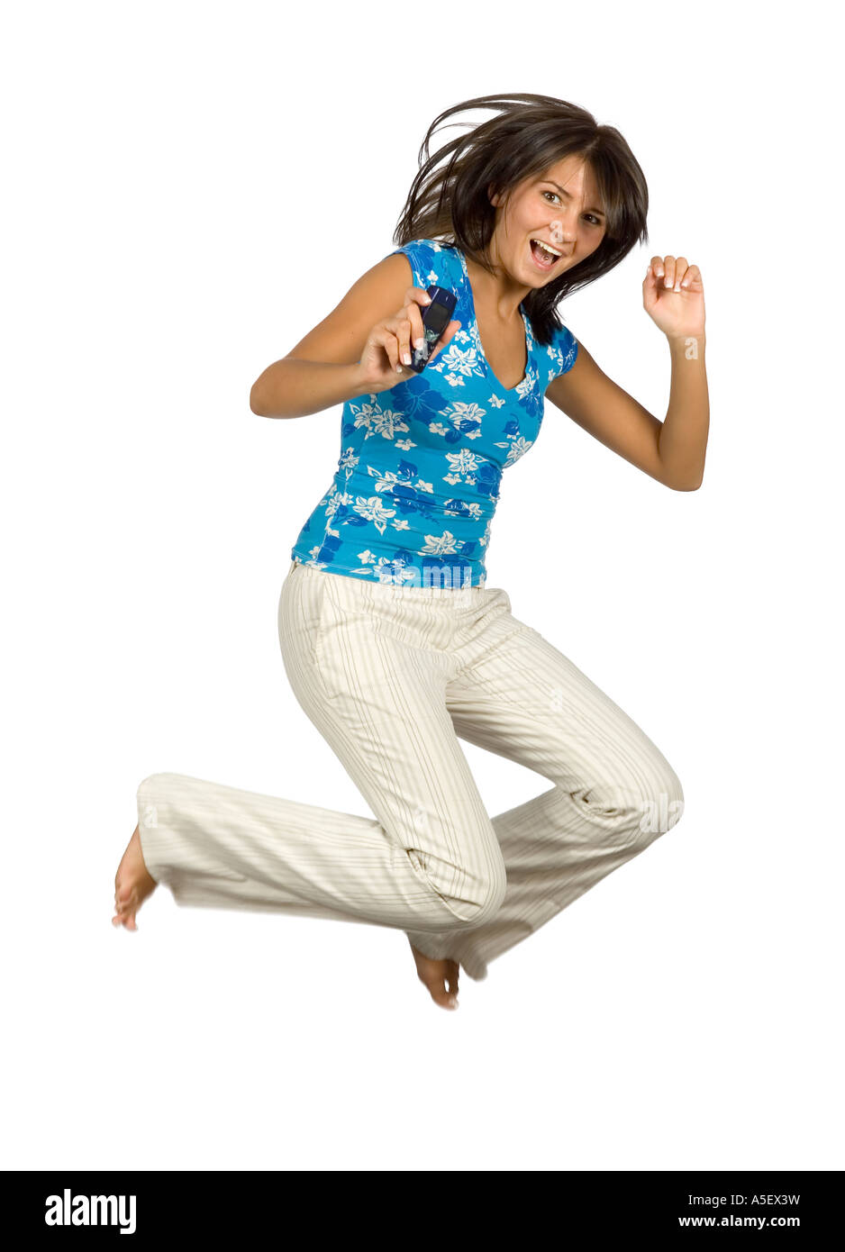 isolated jumping happy woman with cell phone Stock Photo - Alamy