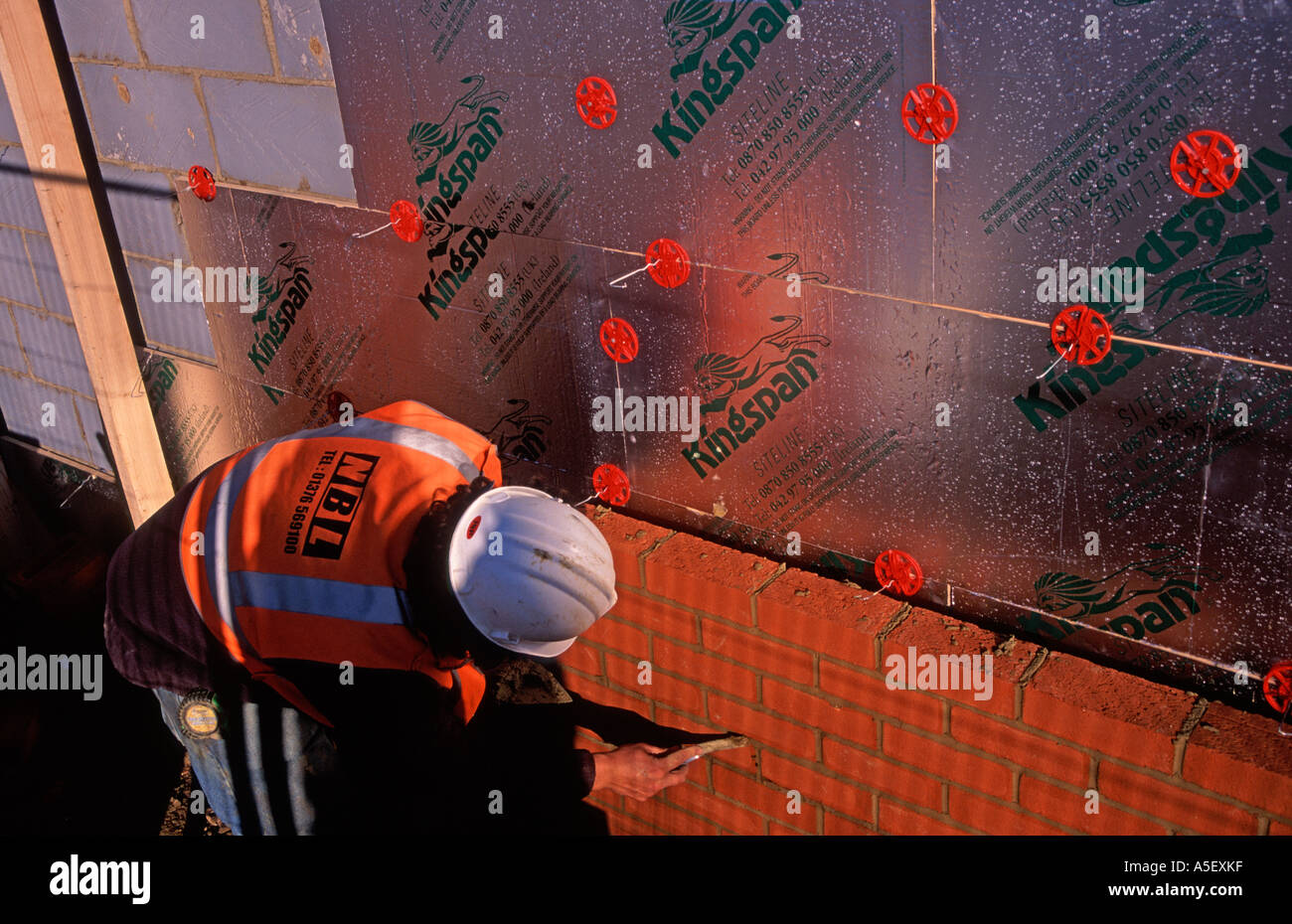 Bricklayers building a new wall on a building site Stock Photo - Alamy
