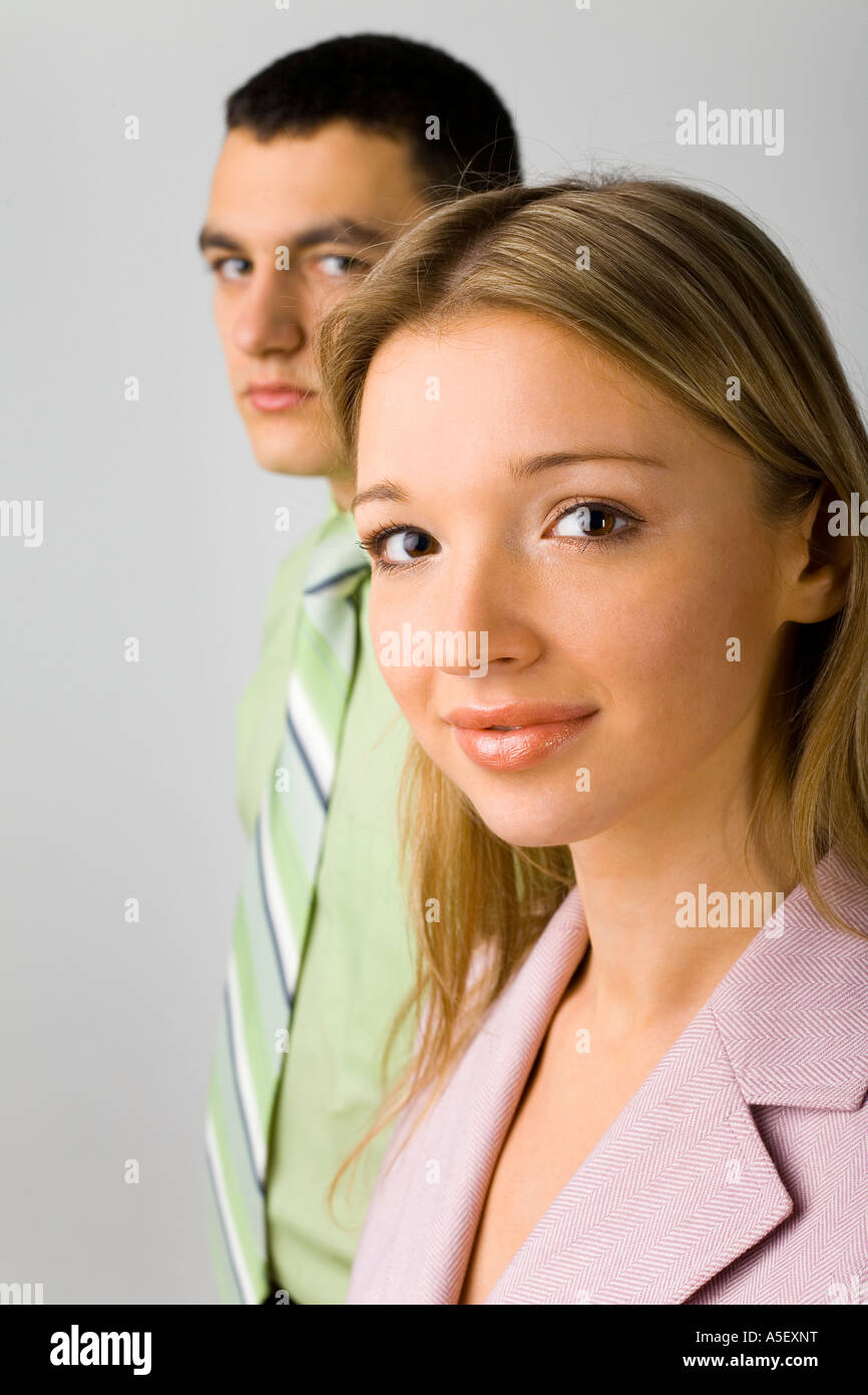Closeup of two business people s faces Woman is on the front Focus on ...