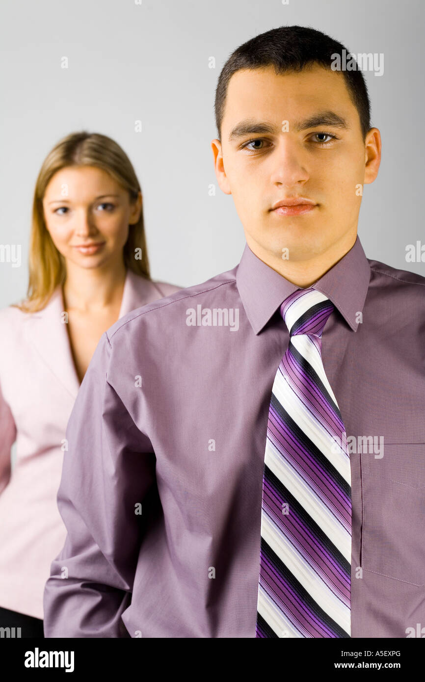 Portrait of two business people Man is on the front Focus on his face ...